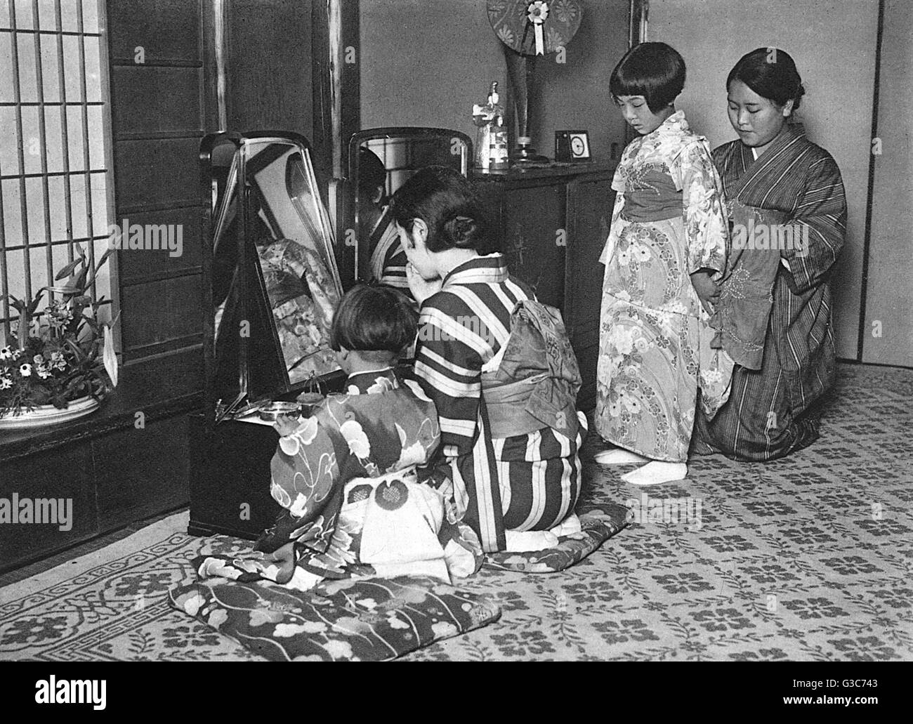 Japanese family getting dressed Stock Photo - Alamy