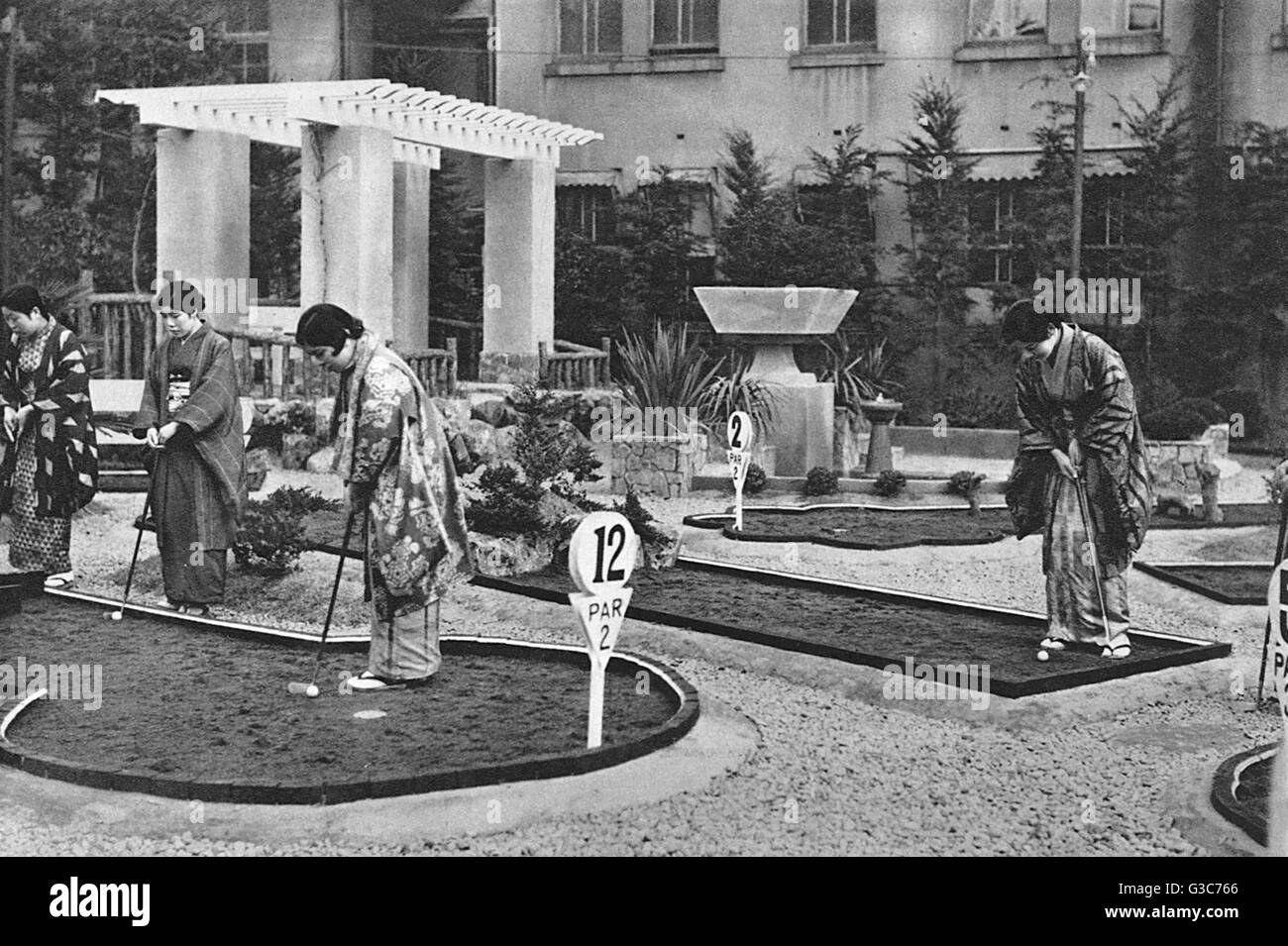 A group of Japanese women play miniature golf Stock Photo - Alamy