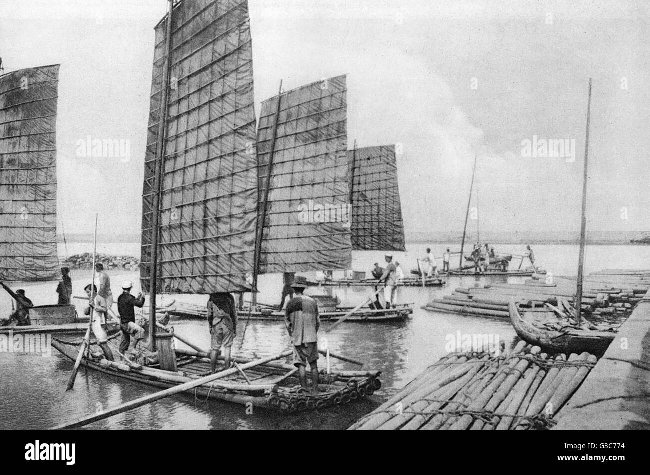 Formosan men aboard their boats Stock Photo - Alamy