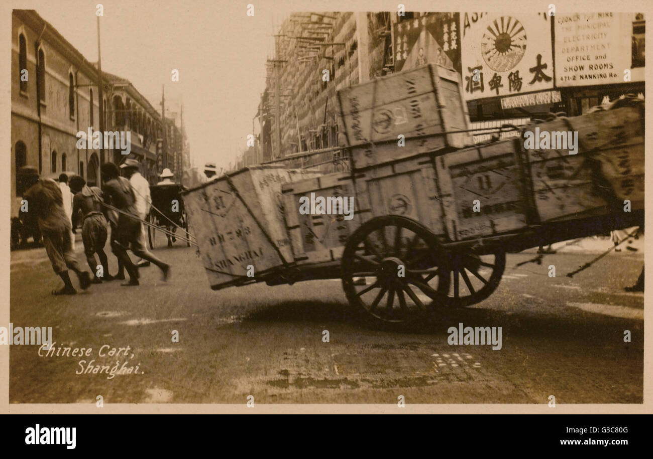 China - Shanghai - Heavy cart pulled by a human team Stock Photo - Alamy