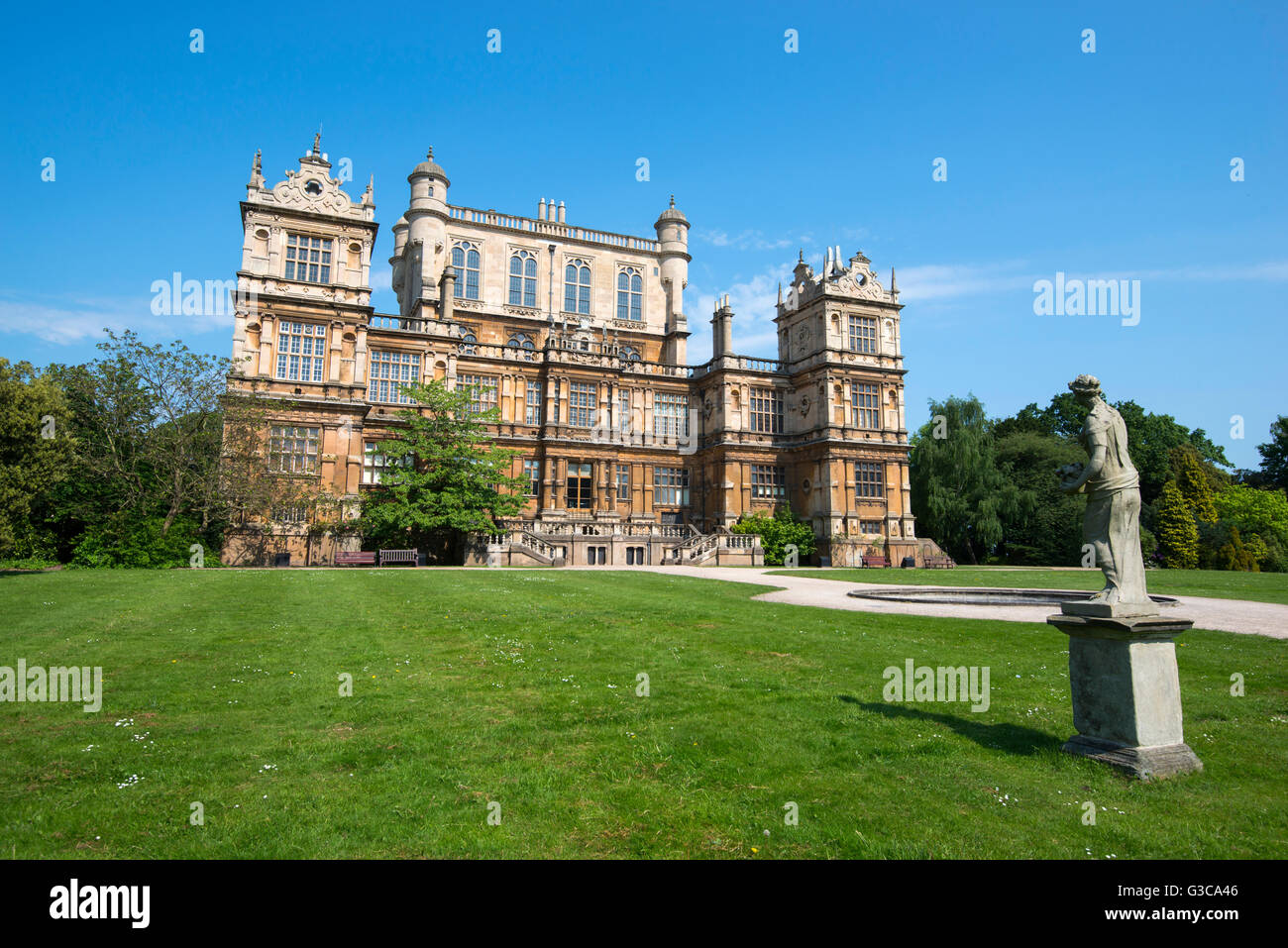 Wollaton Hall and stone statue in the gardens, Nottingham England UK ...