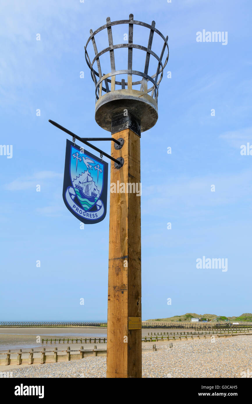 Beacon with brazier and progress sign on the seafront promenade at ...