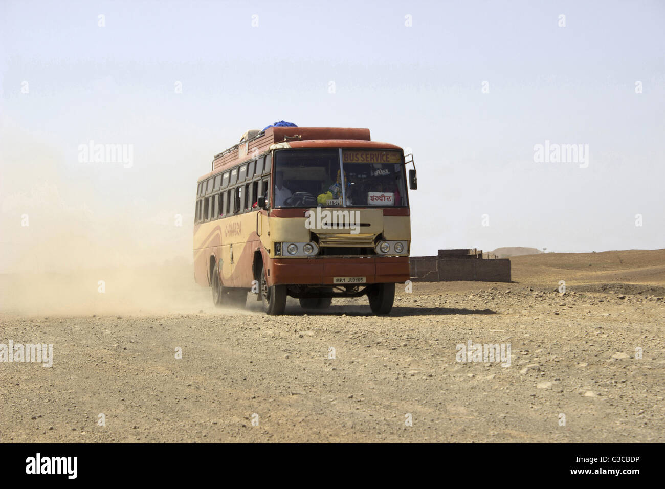 Public bus transport on dirt road . Indore, Madhya Pradesh, India Stock ...
