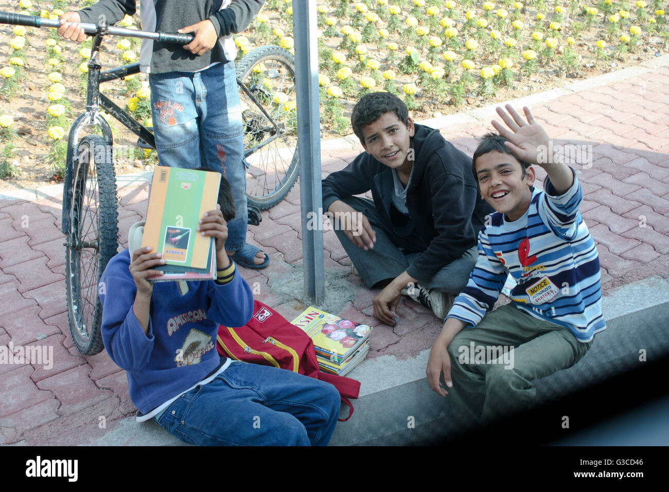 Some young boys saying hi and waving by the side of the road in Turkey ...