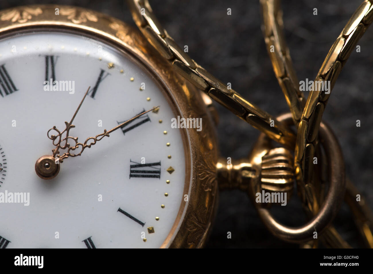 A small golden pocket watch Stock Photo - Alamy