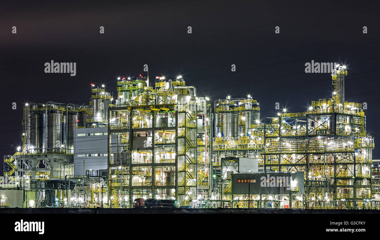 Oil refinery at night Stock Photo - Alamy
