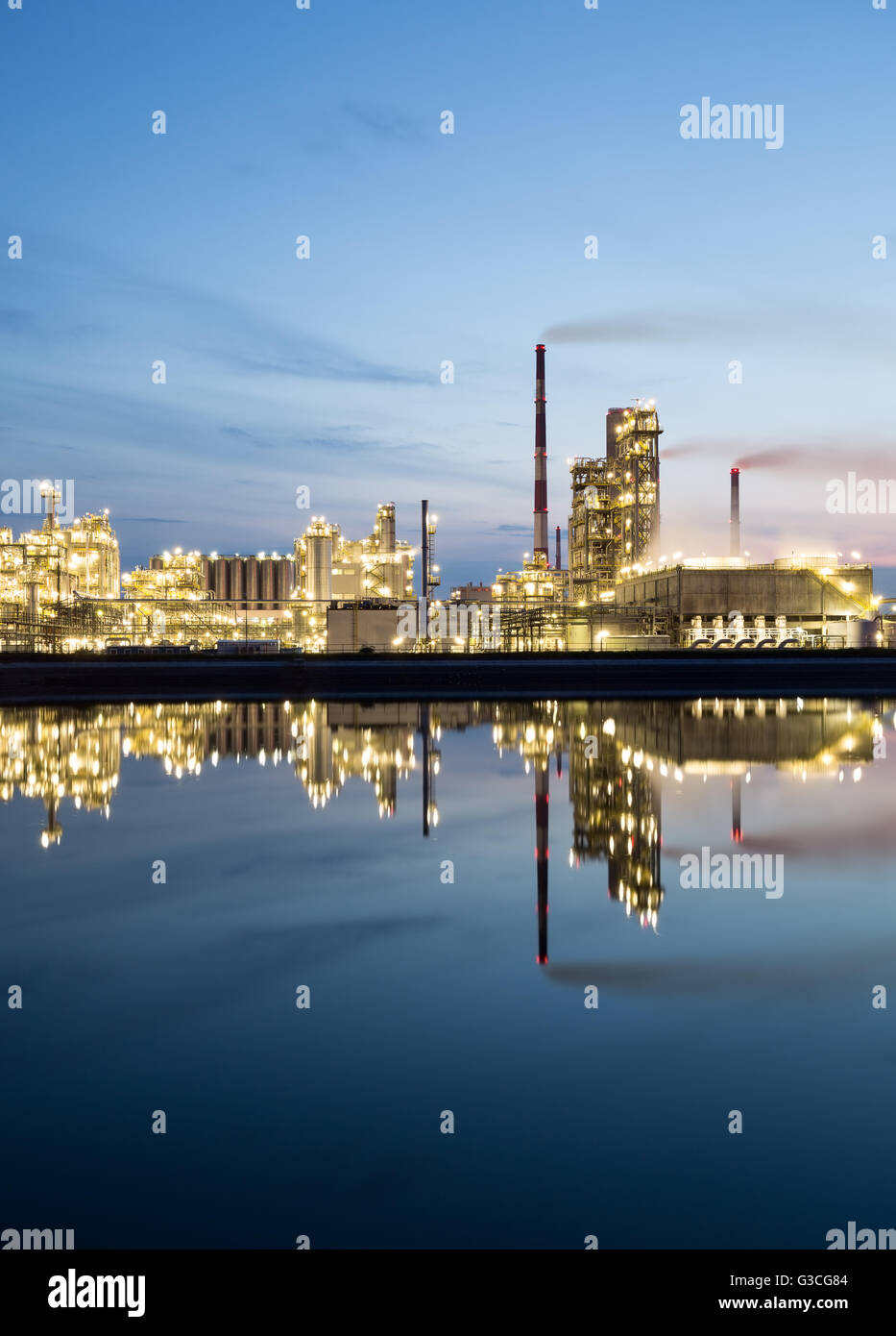 Oil refinery at night Stock Photo - Alamy