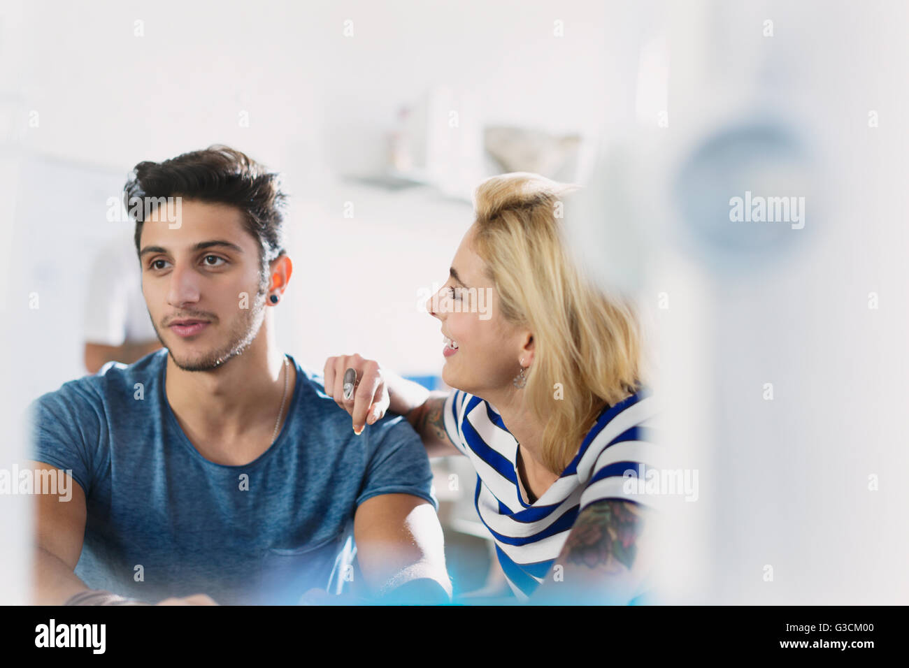 Young couple talking Stock Photo - Alamy