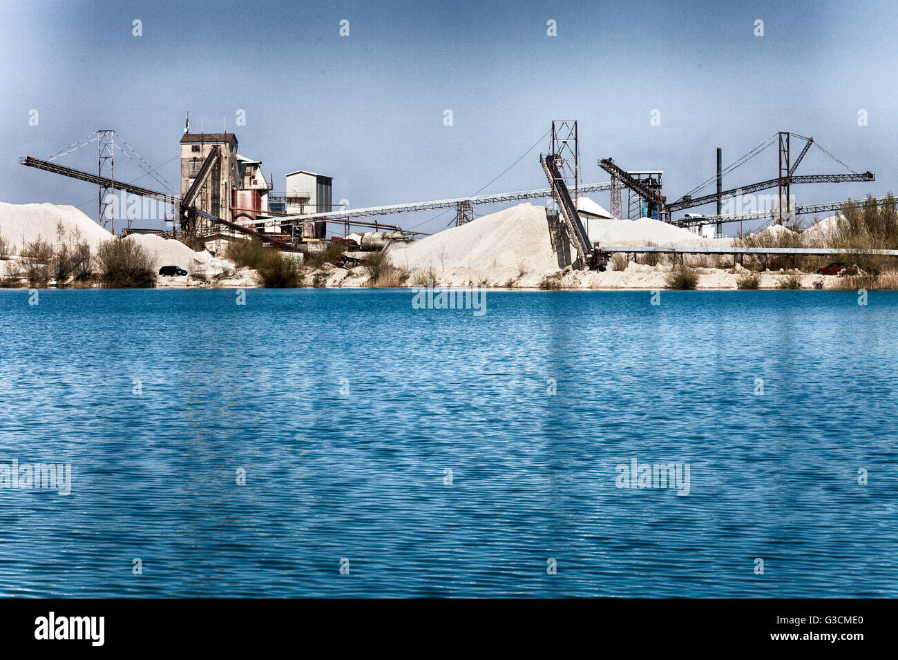Quarry pond with gravel quarry Stock Photo - Alamy