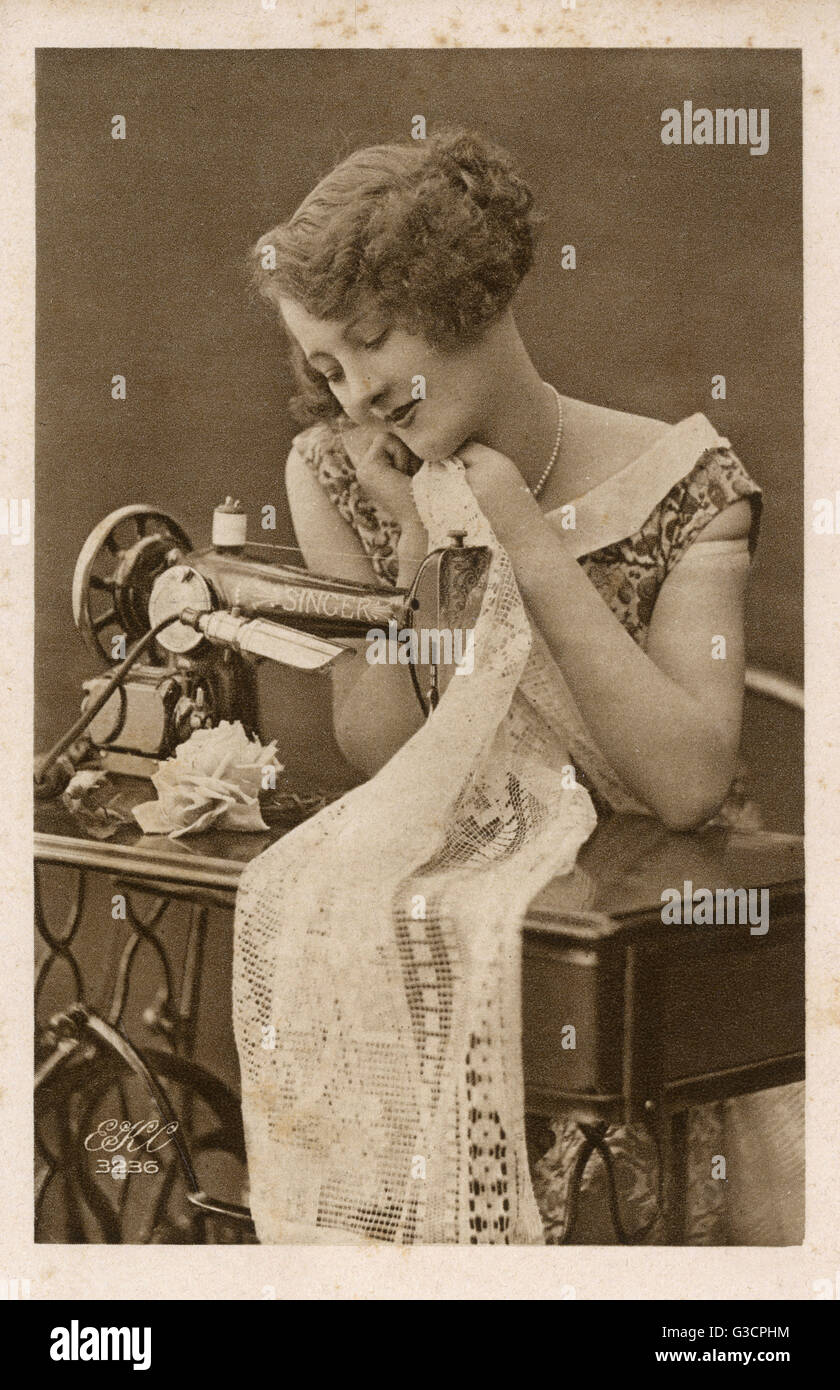 Young woman using a Singer Sewing Machine Stock Photo - Alamy
