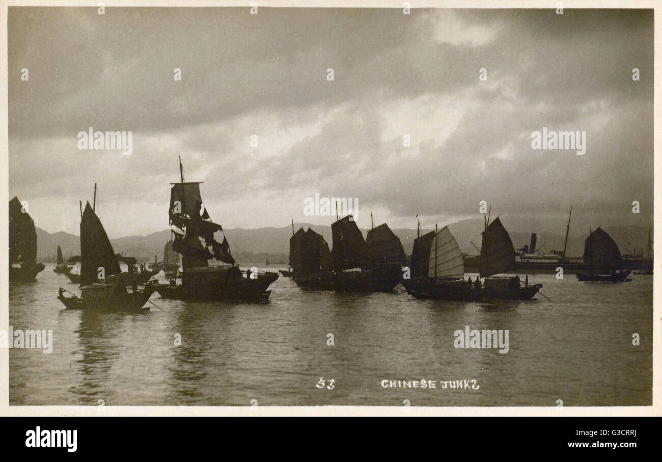 A fleet of Chinese junks - at dusk Date: 1920s Stock Photo - Alamy