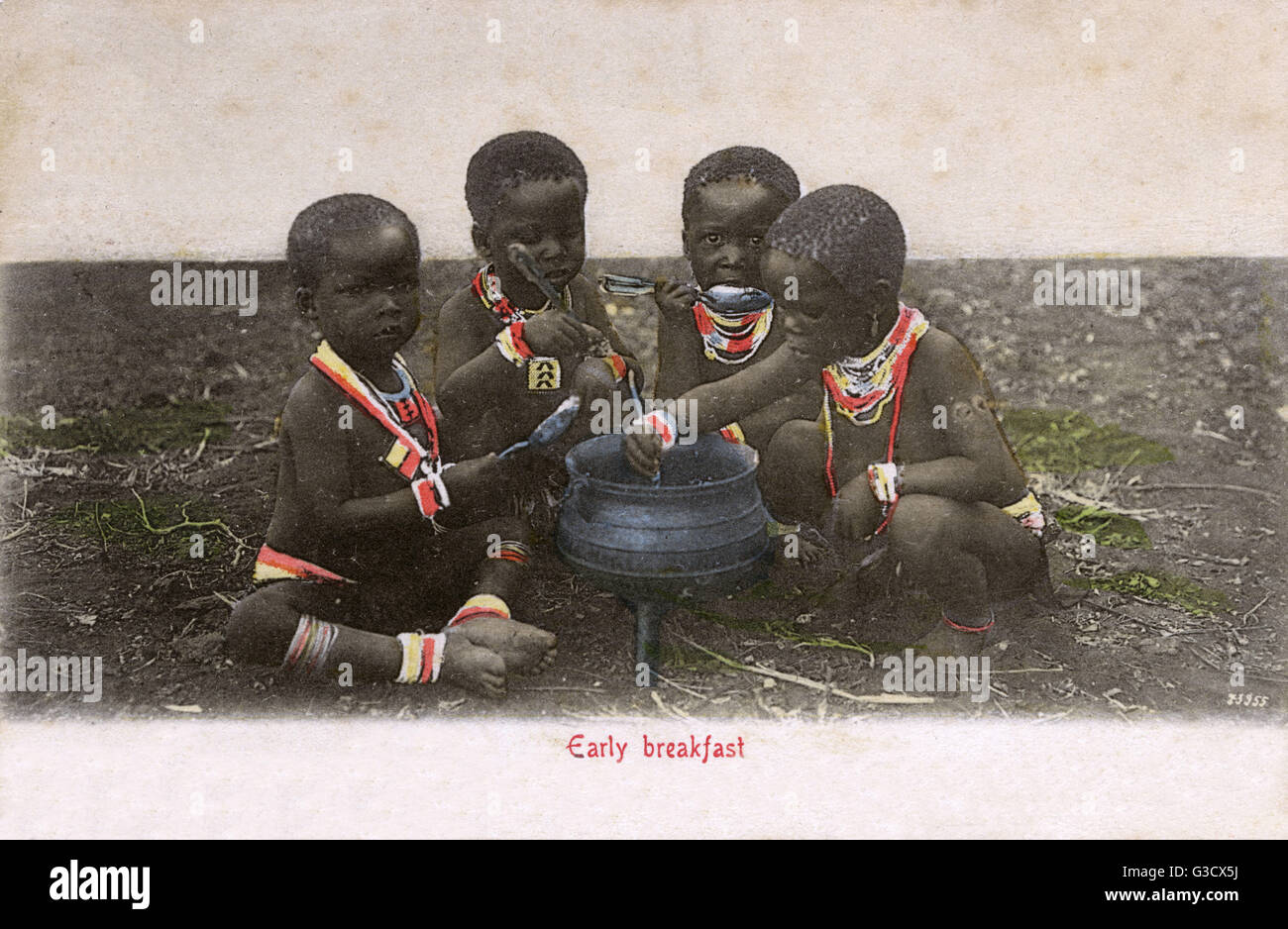 Four young Zulu children enjoy an 'early breakfast' Stock Photo - Alamy