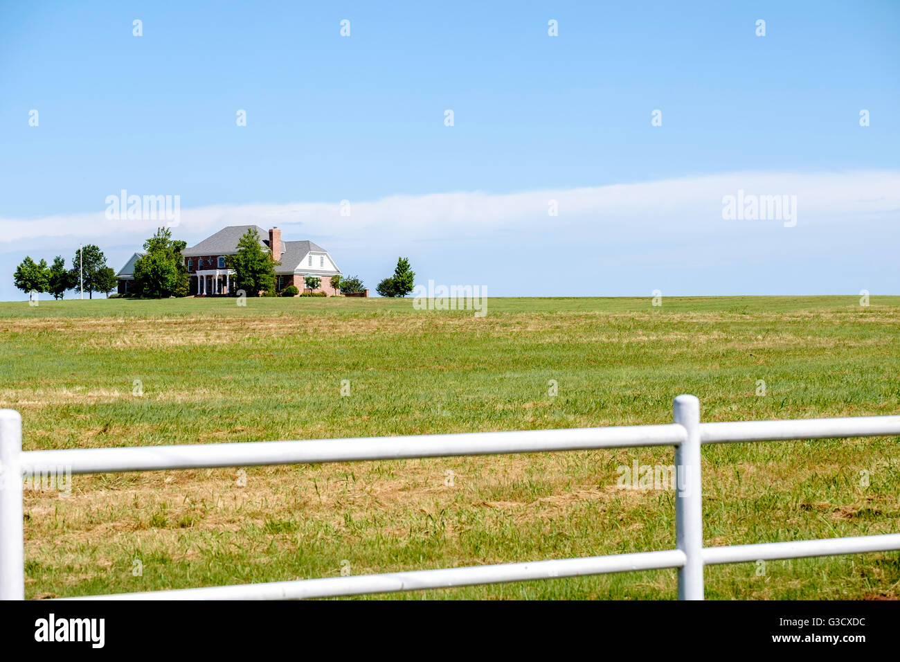 An upscale modern farm or ranch house in the countryside of Oklahoma ...
