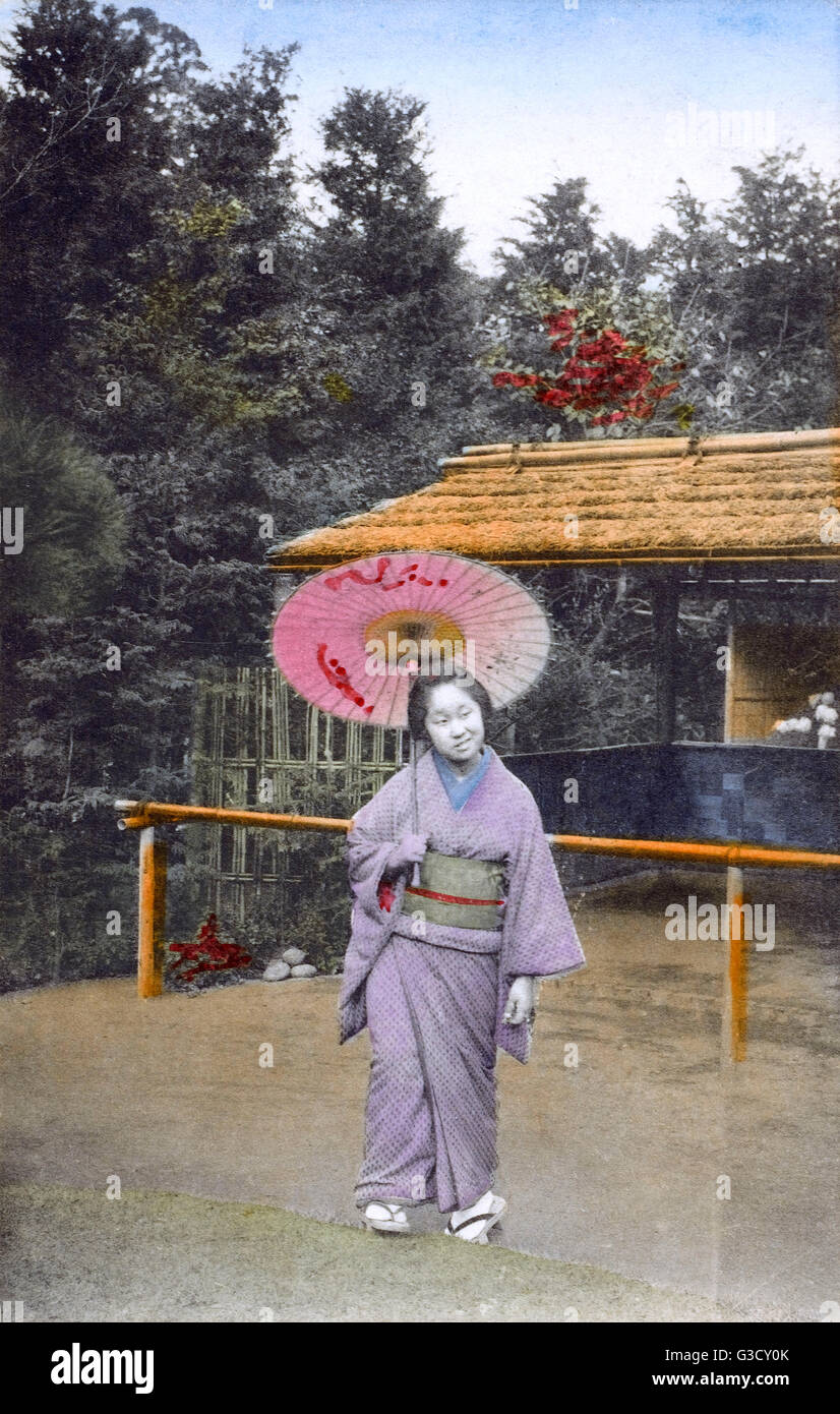 Japan - Geisha Girl walking in garden - bizarre expression Stock Photo ...