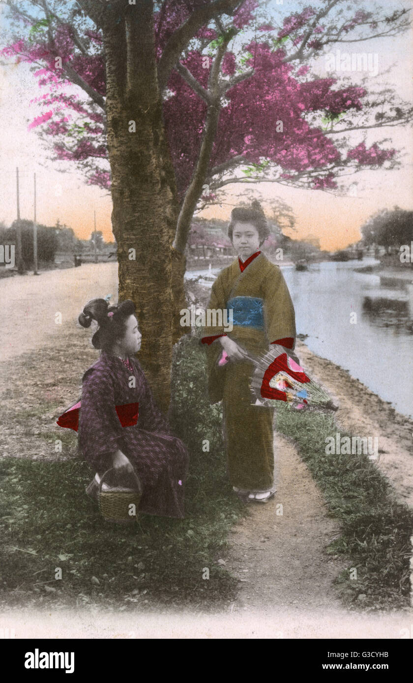 Two Japanese women by the side of a canal / river - Japan Stock Photo ...
