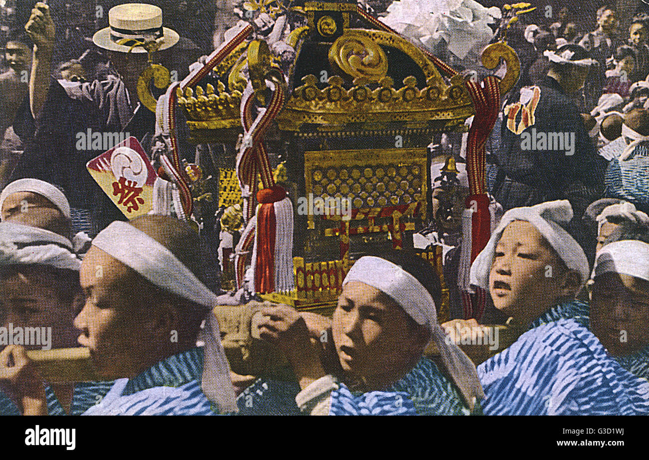 Young boys carrying a Mikoshi - portable Shinto Shrine Stock Photo - Alamy