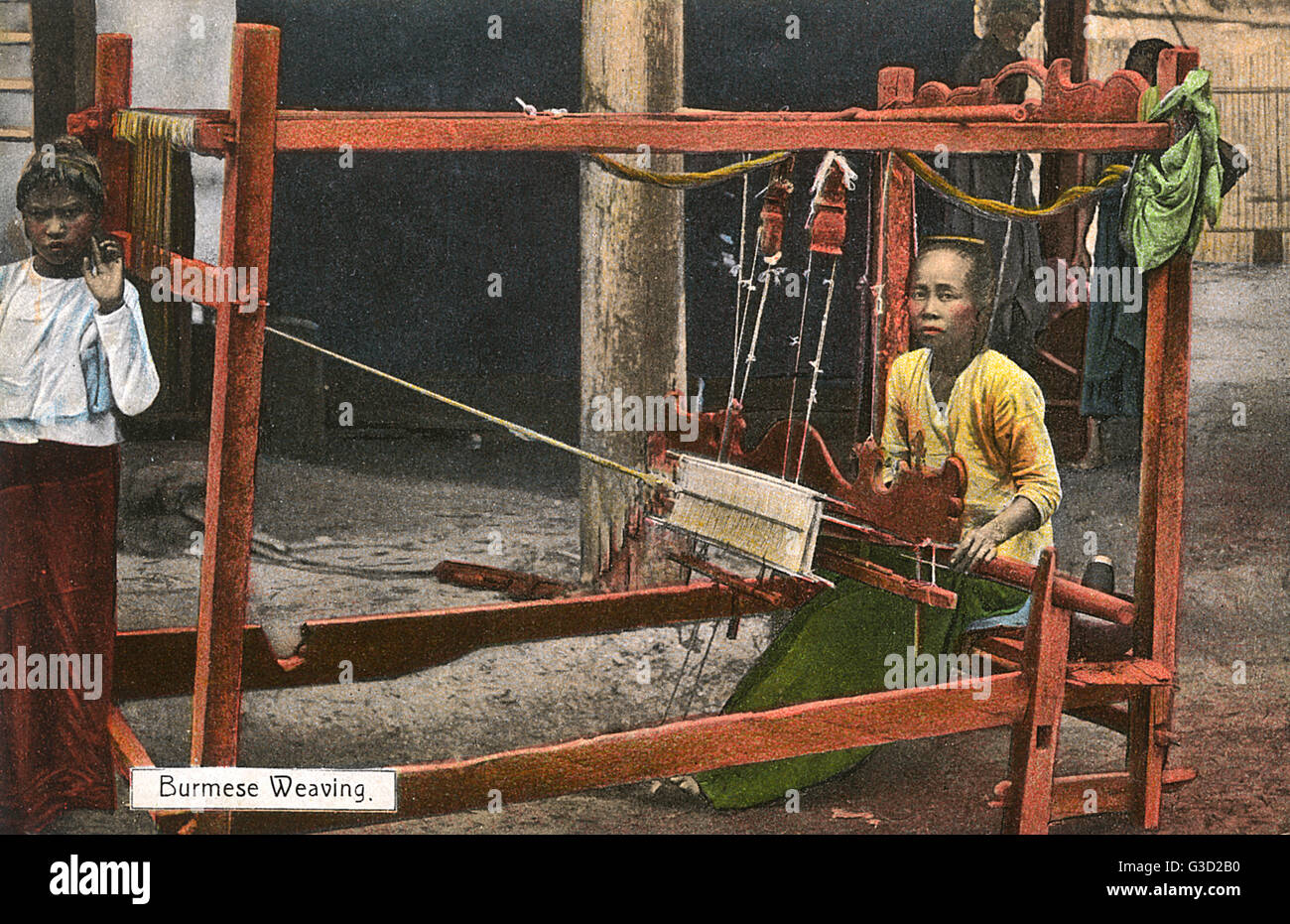 Myanmar - A weaver at work using a wooden frame loom Stock Photo - Alamy