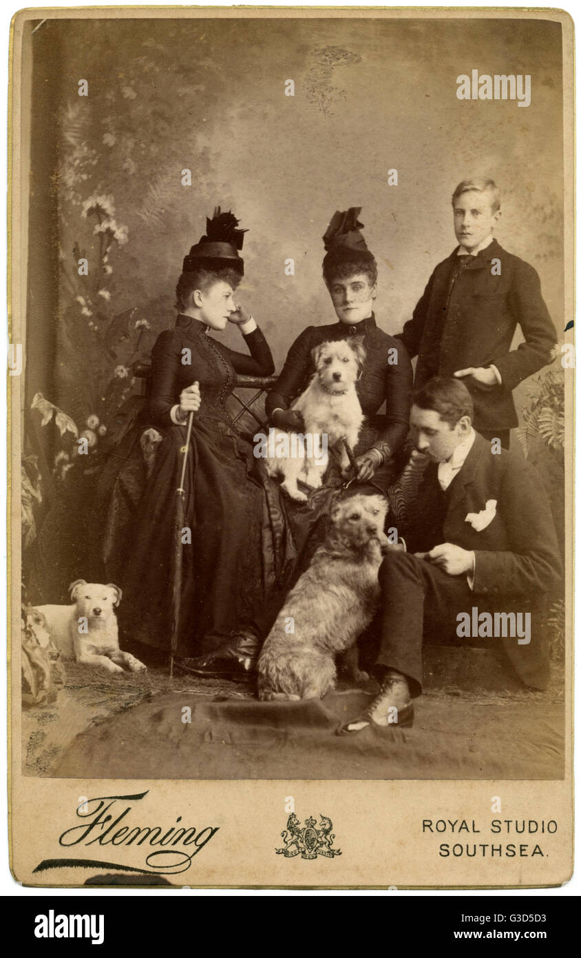Studio portrait, family of four with three terrier dogs Stock Photo - Alamy