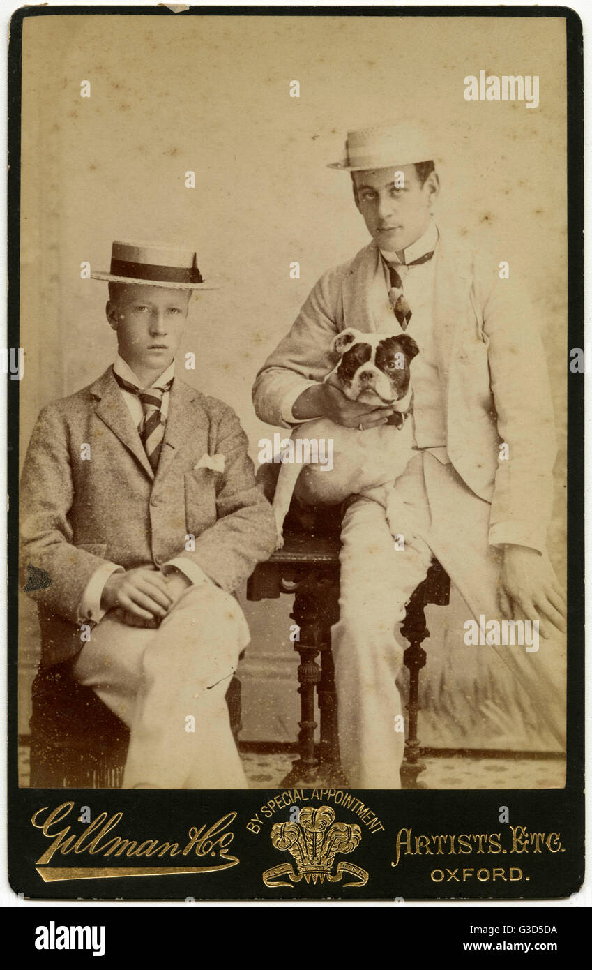 Studio portrait, two young men with bulldog Stock Photo - Alamy