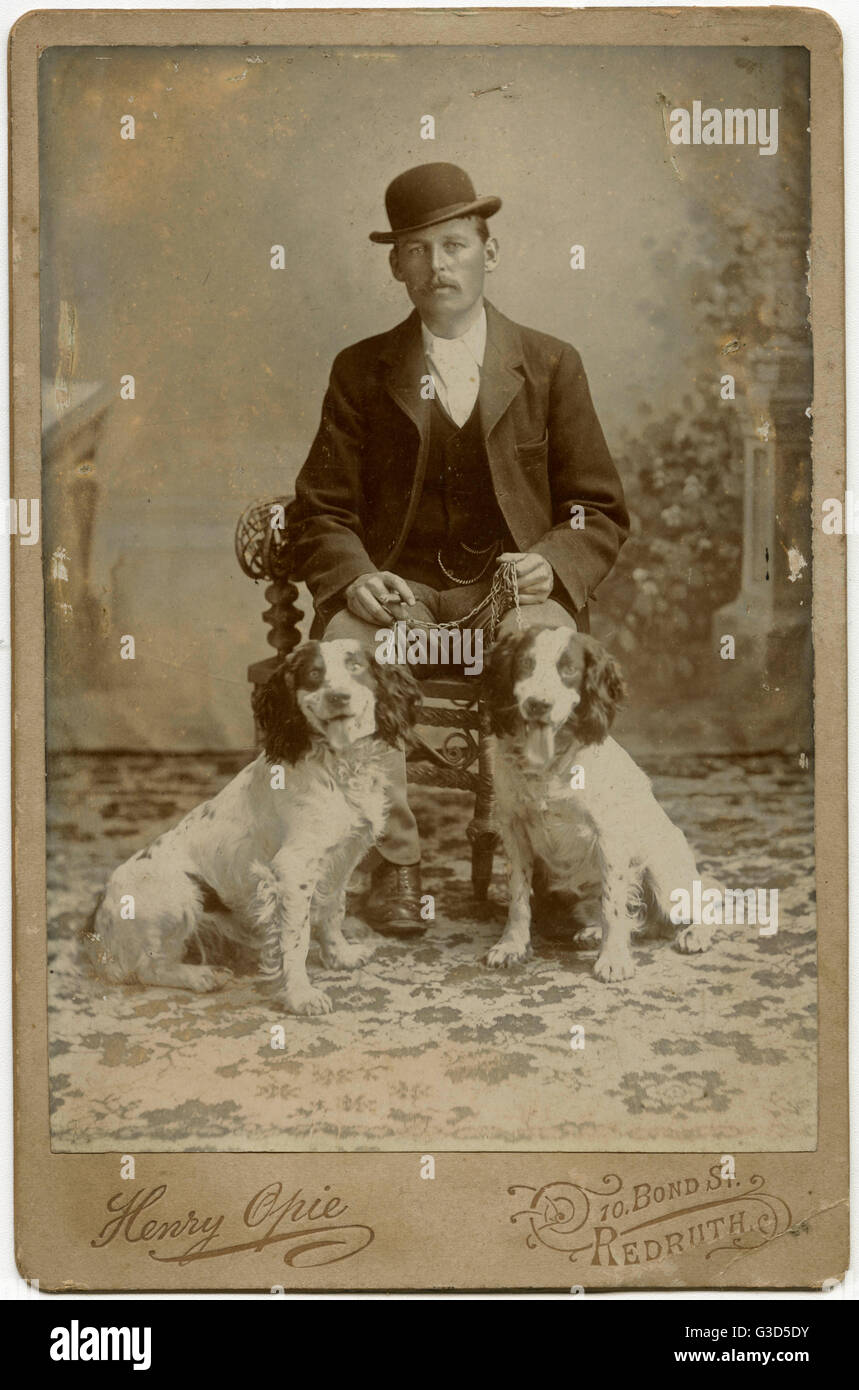 Studio portrait, man with his dogs Stock Photo - Alamy