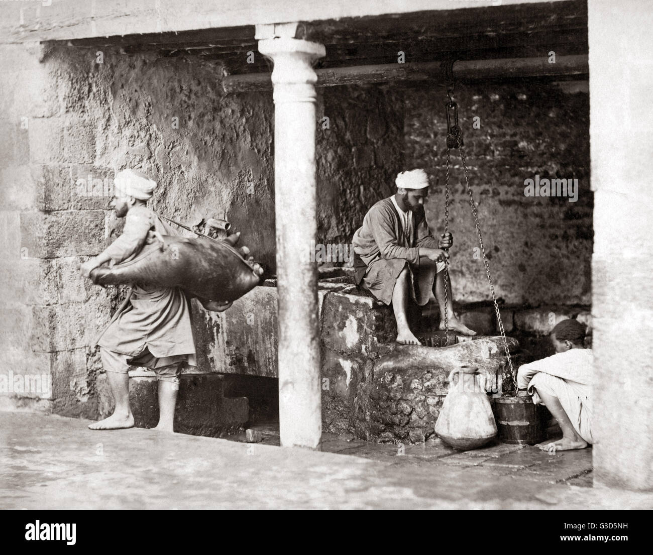 Water carriers filling their bags, Egypt, circa 1880 Stock Photo - Alamy