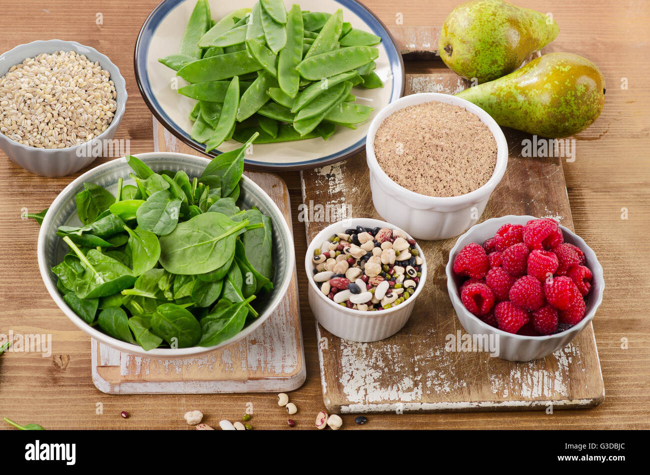 Fiber rich foods on wooden background. Top view Stock Photo - Alamy
