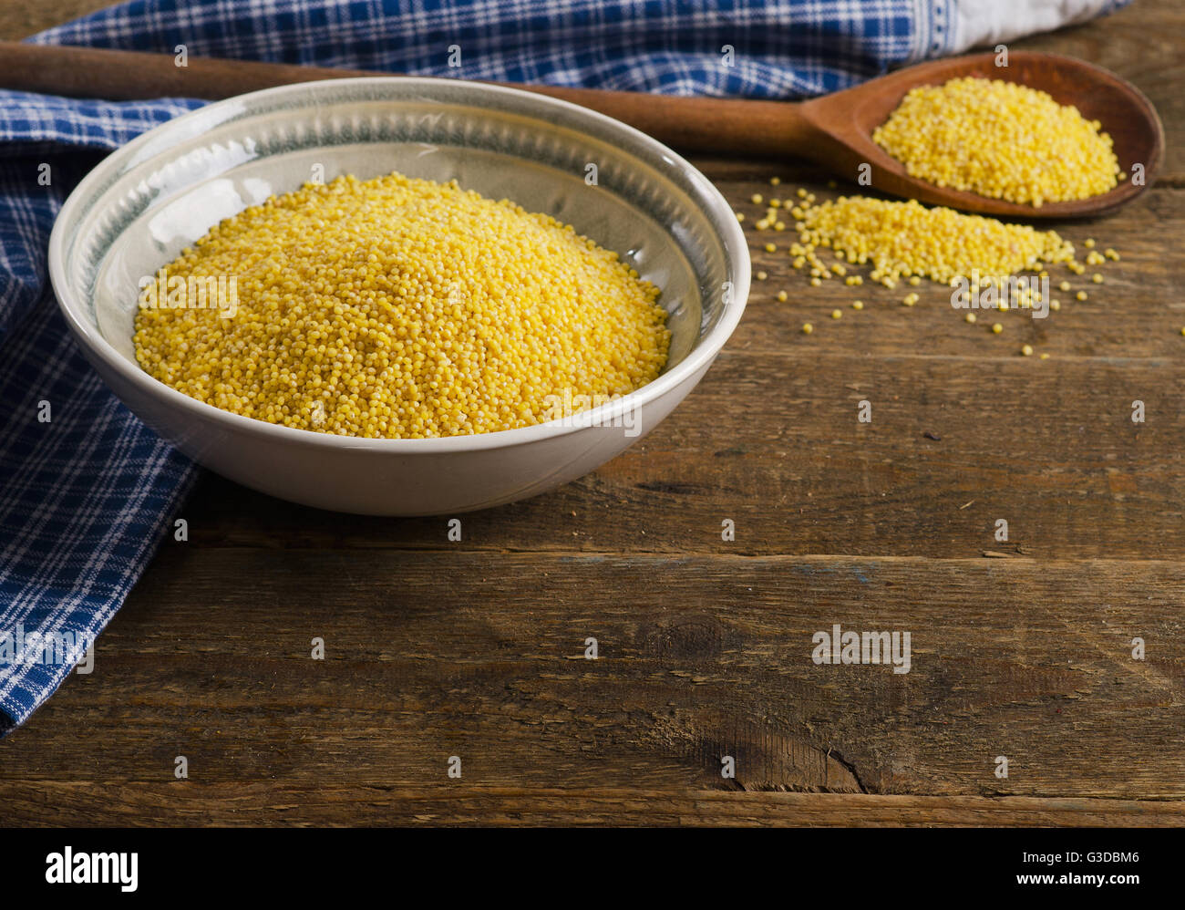 Raw Millet in a bowl. Top view Stock Photo - Alamy