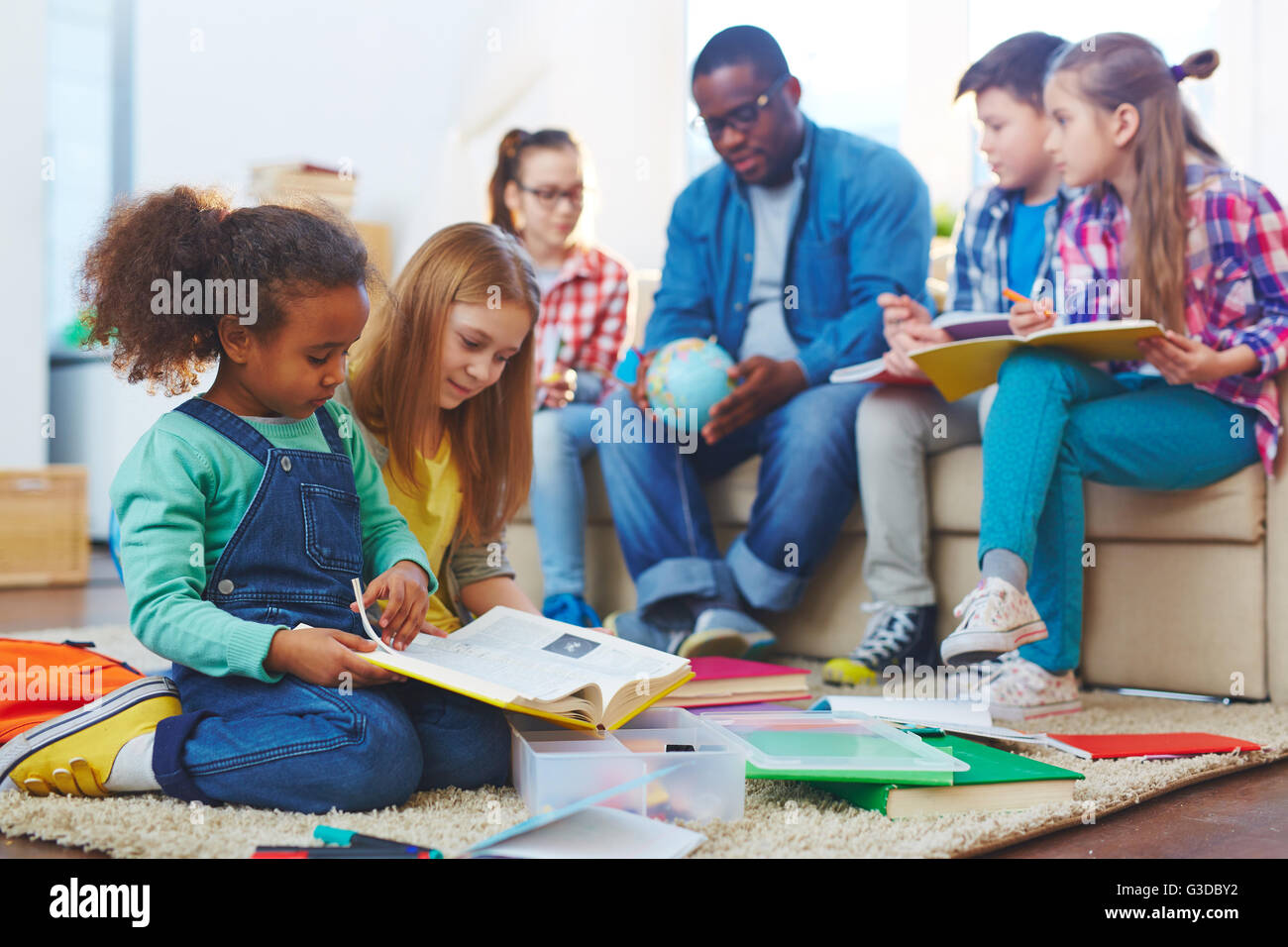 Children with book Stock Photo - Alamy