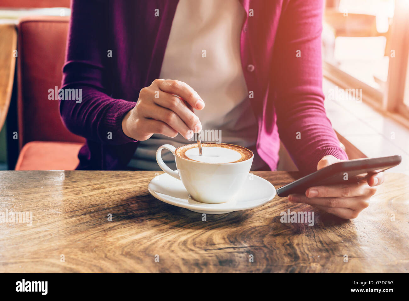 woman using smartphone in coffee shop with vintage tone Stock Photo - Alamy