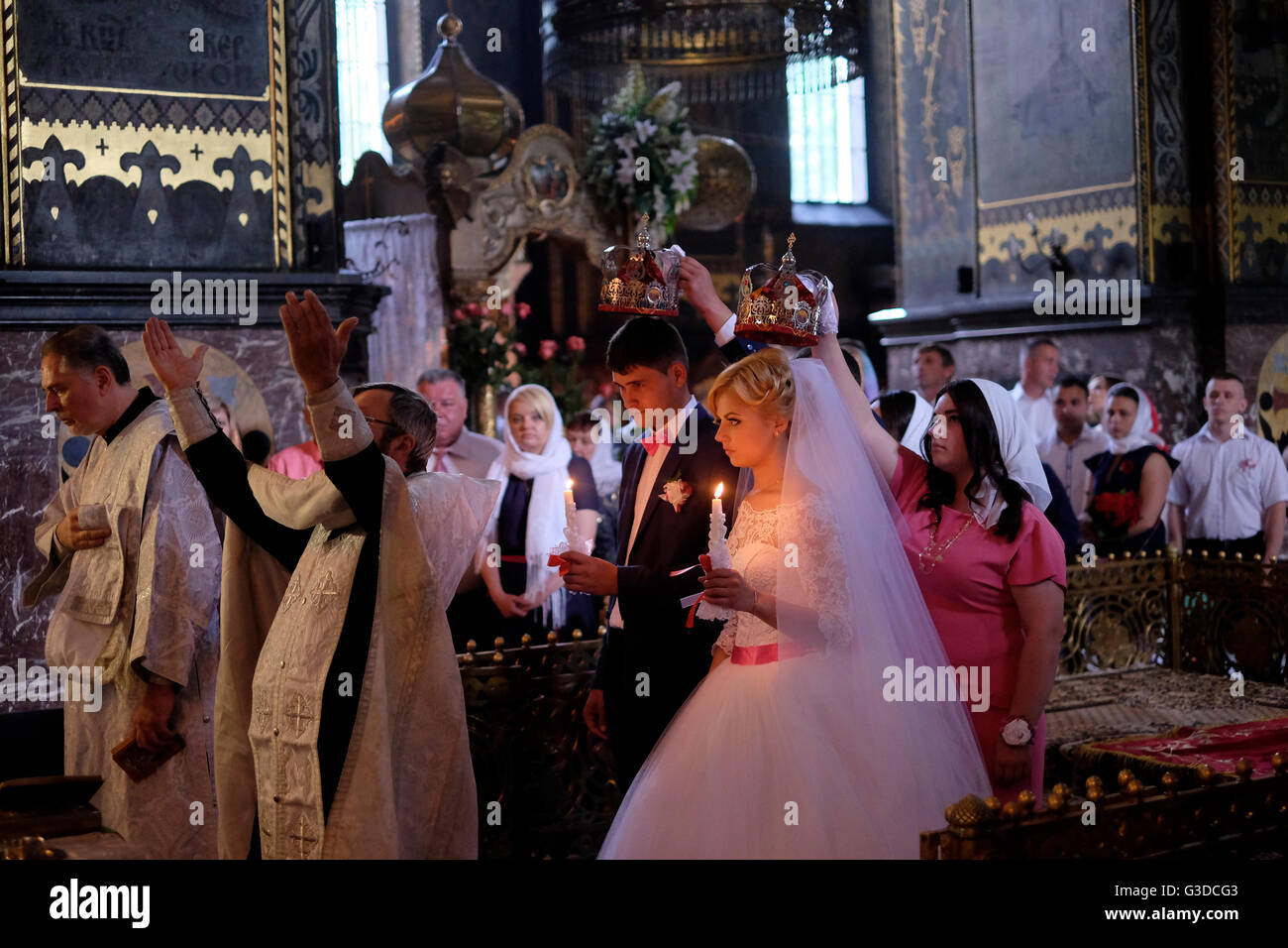 Ukrainian groom and bride are crowned during traditional crowning ...