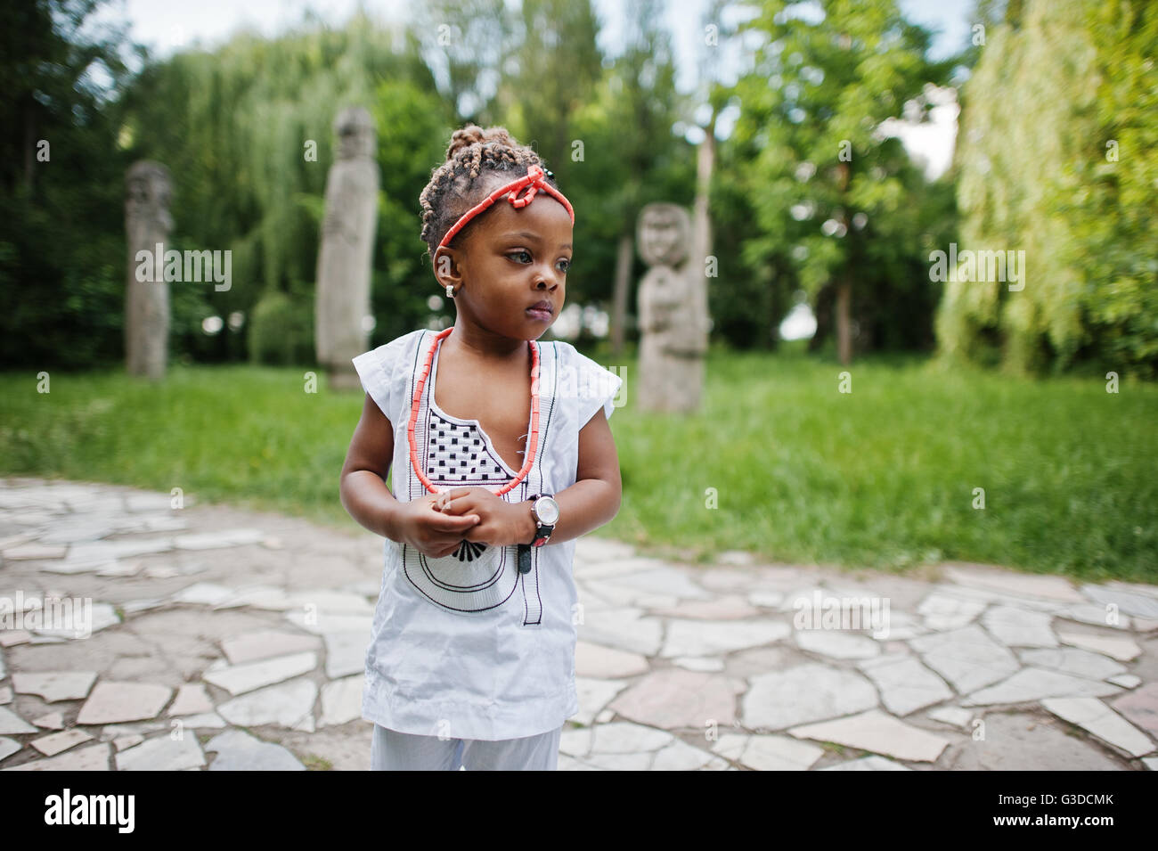 Close up portrait of african baby girl walking at park Stock Photo - Alamy
