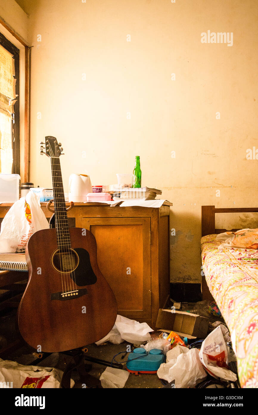 Messy Student Room with Guitar kept at Study Desk Stock Photo - Alamy