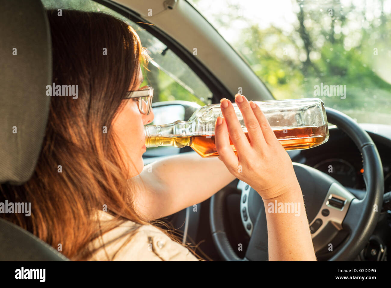 picture of woman drinking alcohol in the car Stock Photo - Alamy