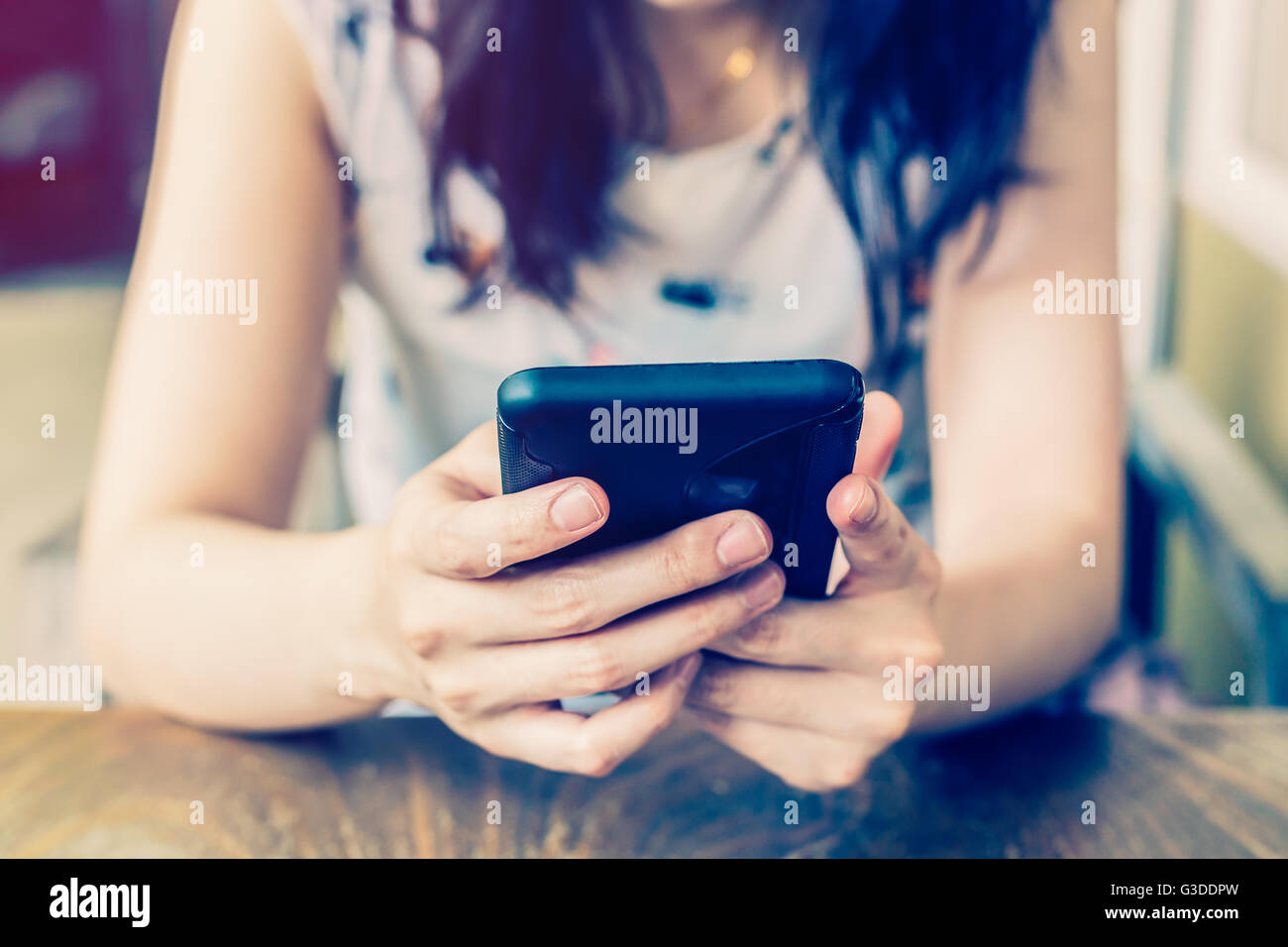 Hand woman using phone in coffee shop with depth of field Stock Photo ...