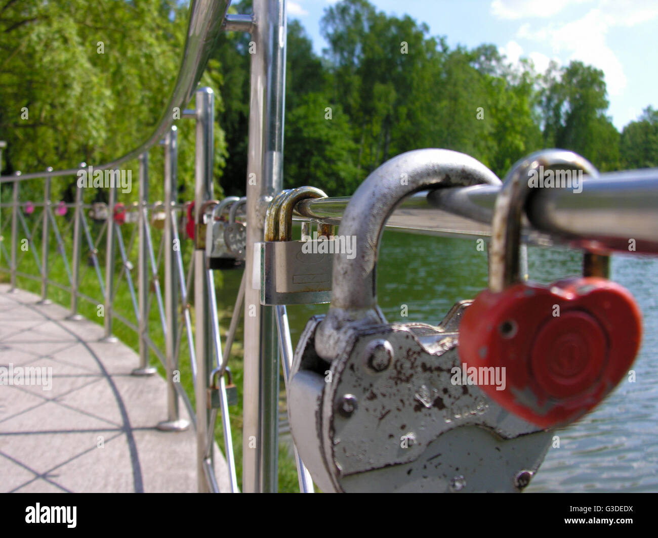 Wedding tradition - to seal the union lock on the fence embankment ...
