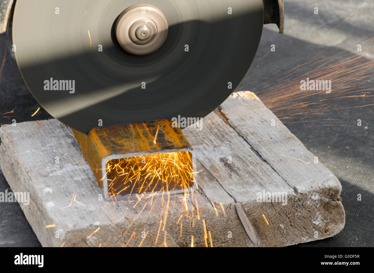 Saw disc while cutting a railing Stock Photo - Alamy