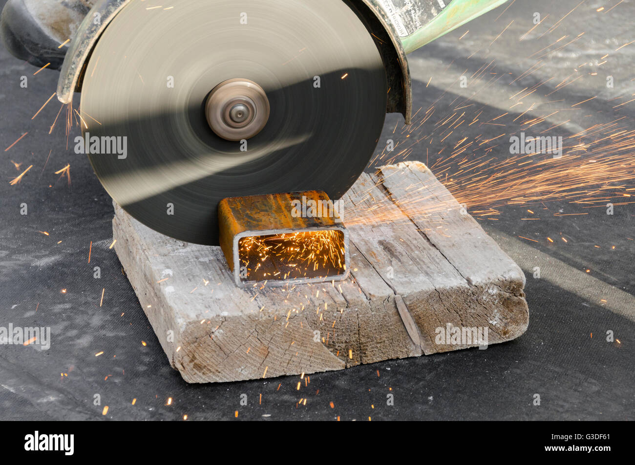 Saw disc while cutting a railing Stock Photo - Alamy
