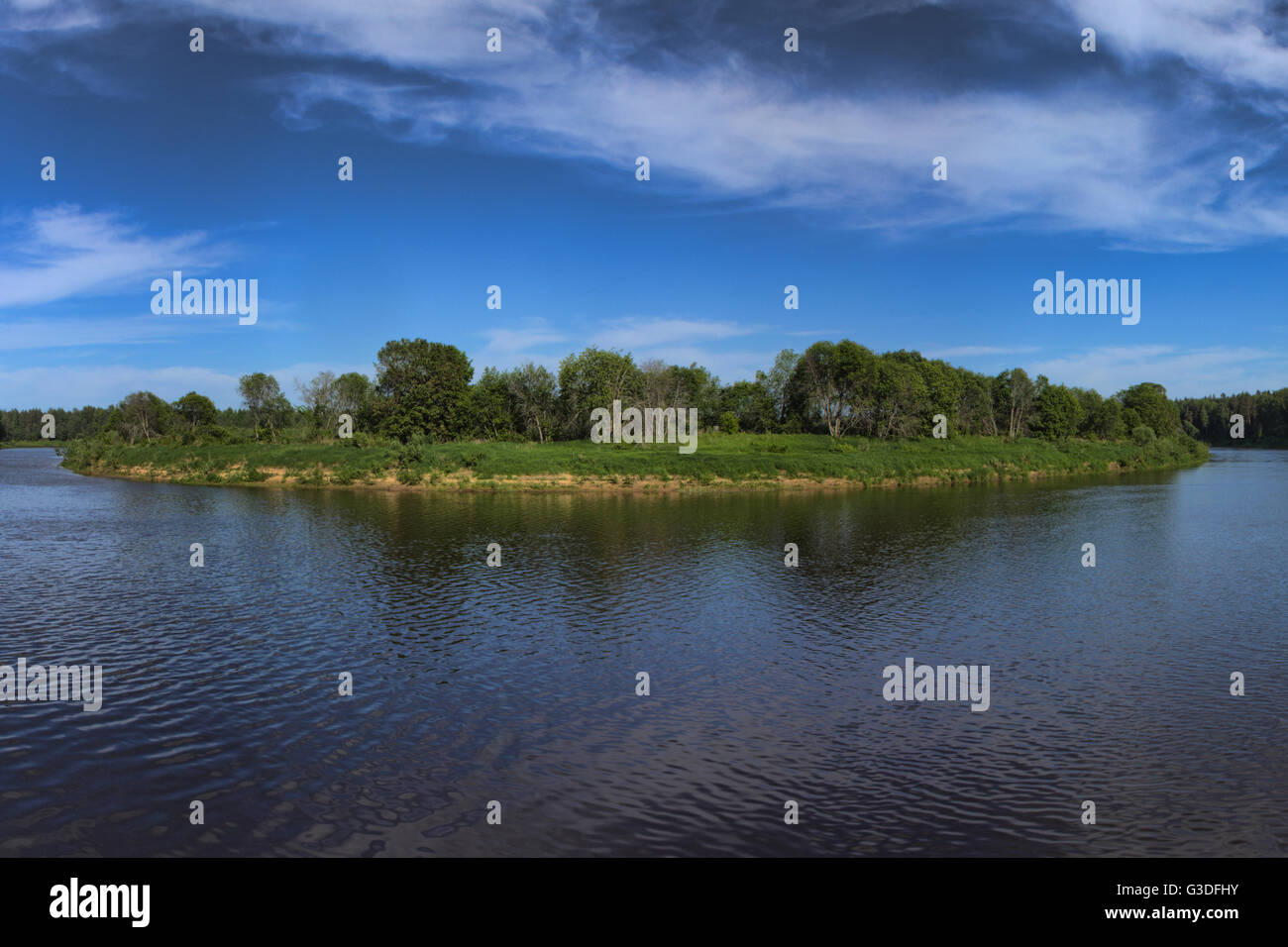small green island in blue lake Stock Photo - Alamy