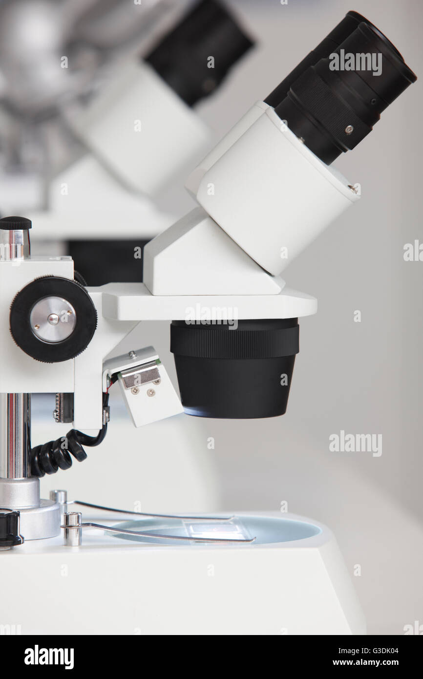 Microscope in the science laboratory. Vertical format Stock Photo - Alamy