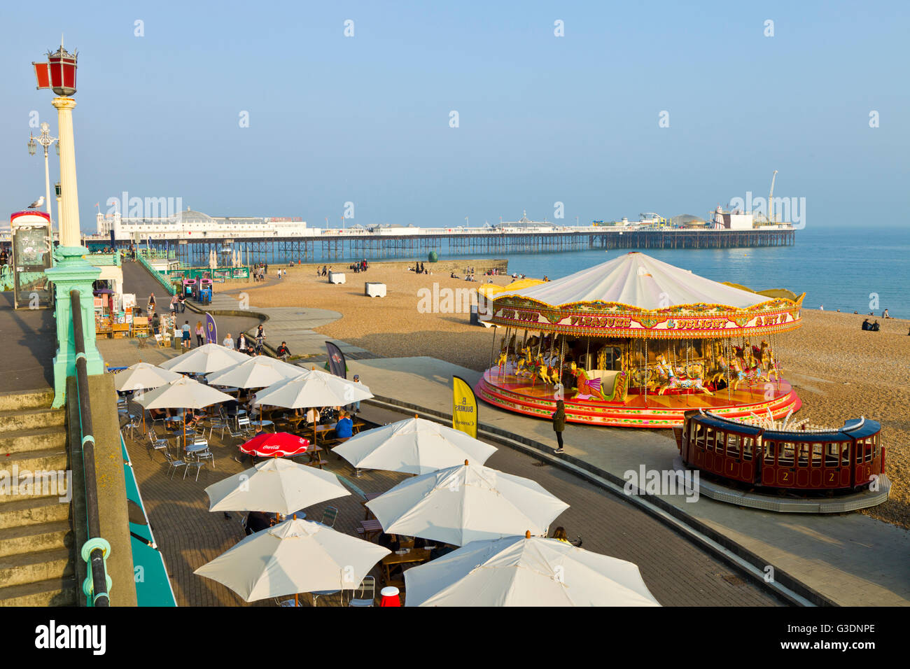 Brighton beach and promenade with the Golden Gallopers and the Palace ...