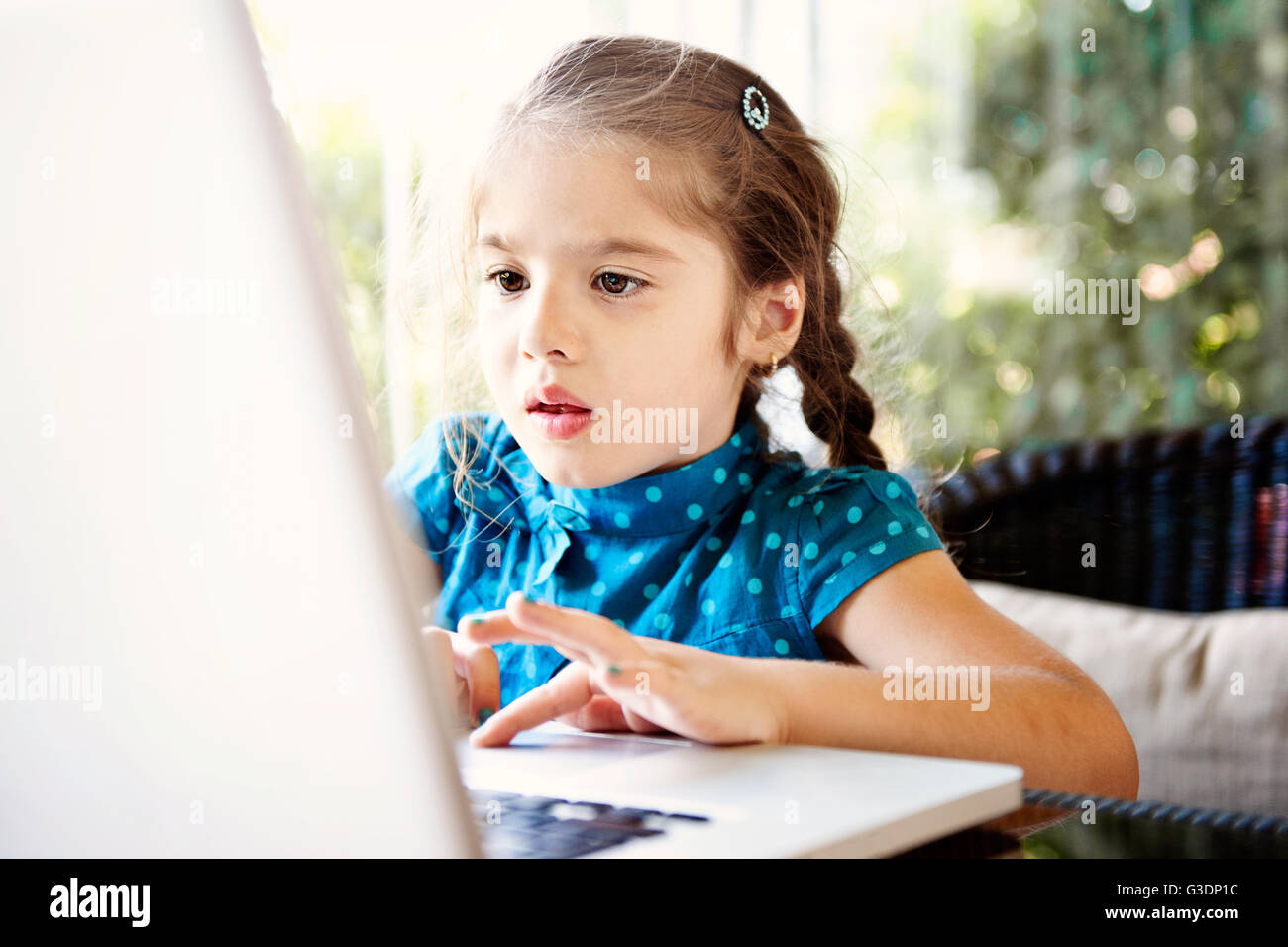 Little girl using computer Stock Photo - Alamy