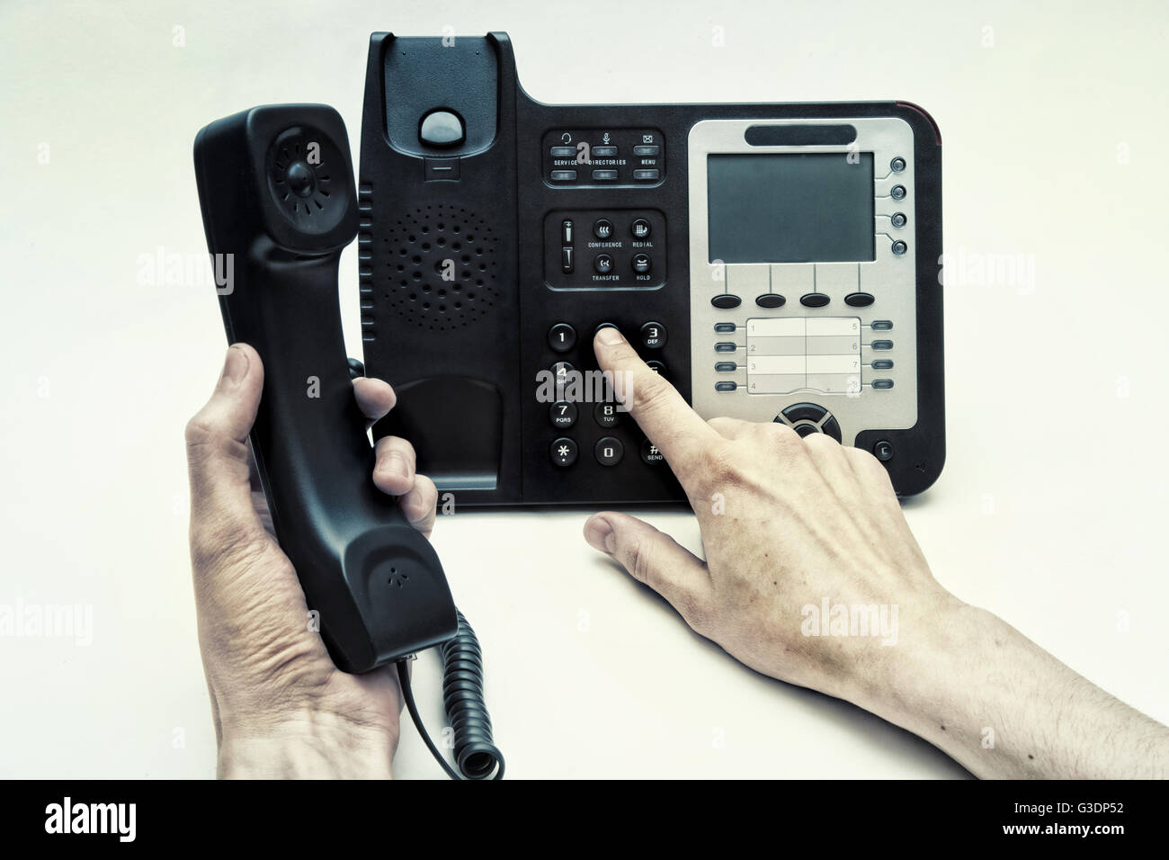 Man's hands with the handset and the phone on white background Stock ...