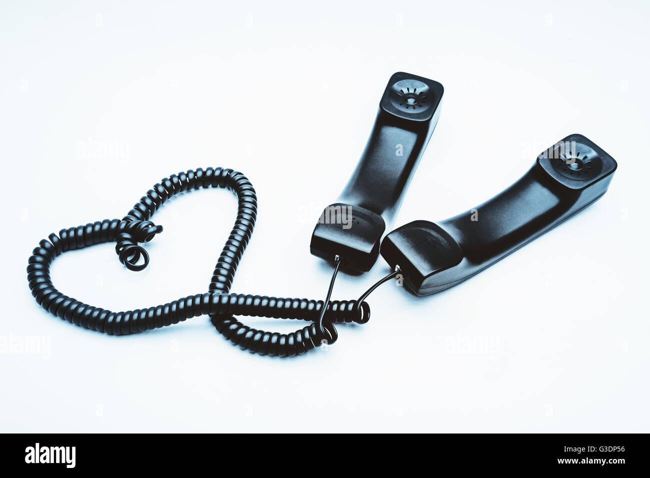 Black telephone receiver with cable on white background Stock Photo - Alamy