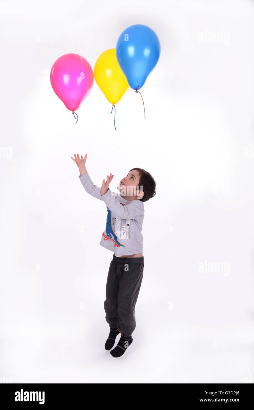 Happy school children jump hi-res stock photography and images - Alamy