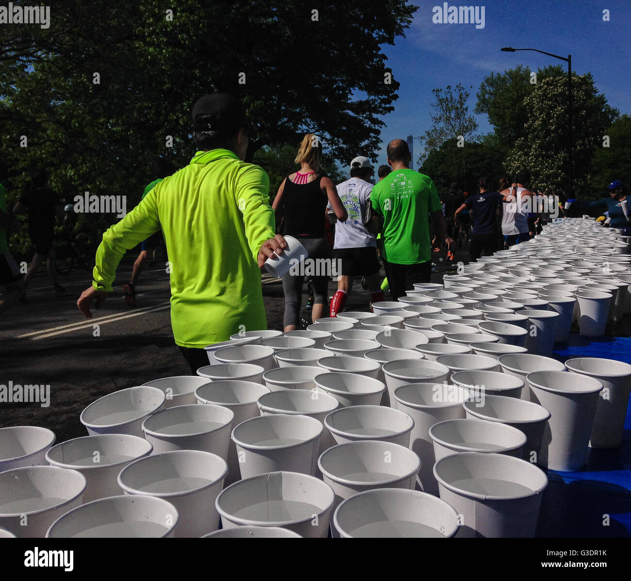 Runners and water station at marathon in Central Park Stock Photo - Alamy