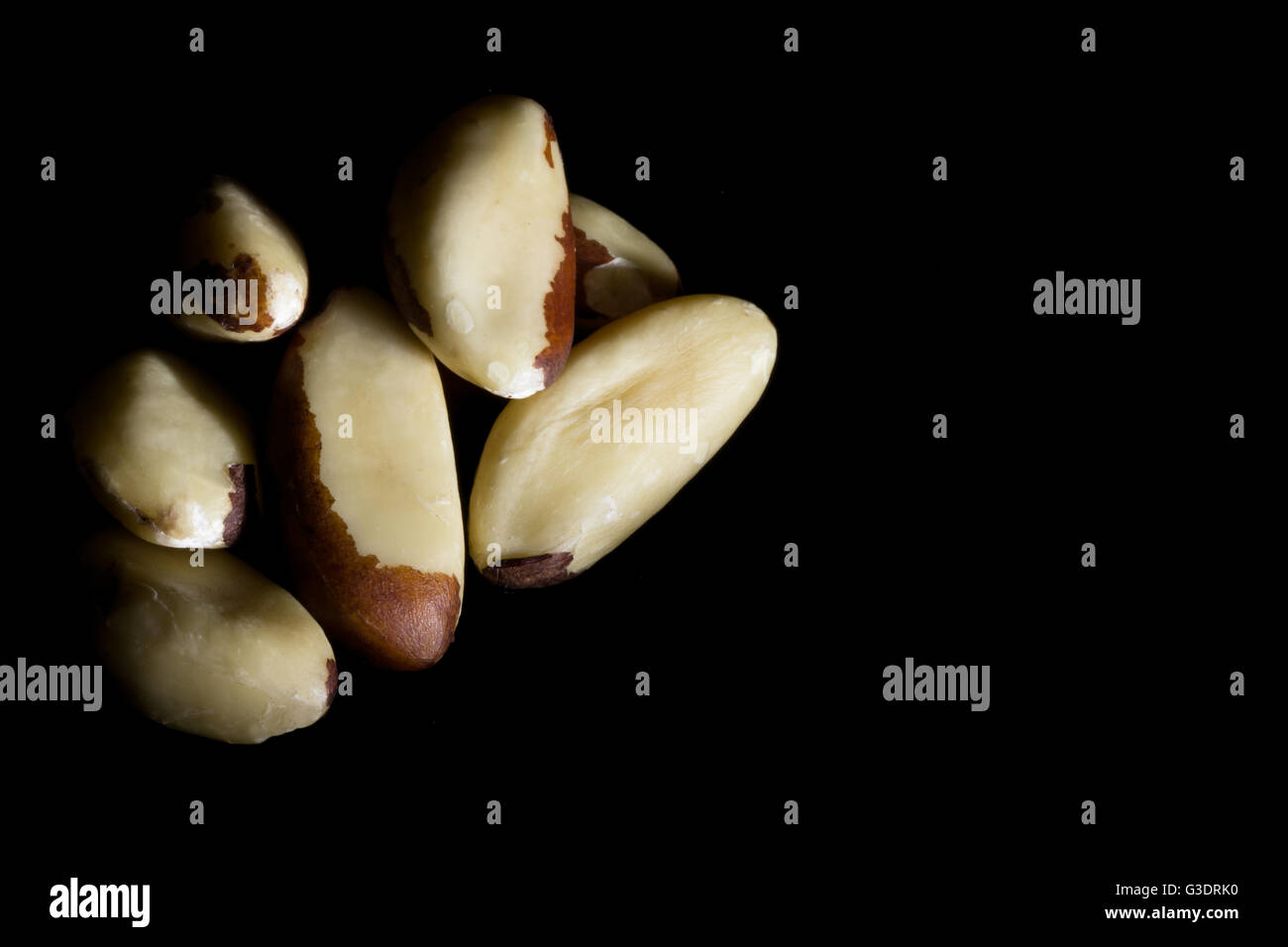 Multiple Brazilian Nuts in black background Stock Photo - Alamy