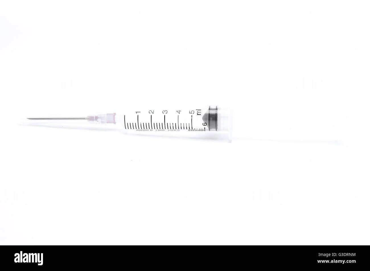 Fairly standard design single use syringe (disposable syringe) on white ...
