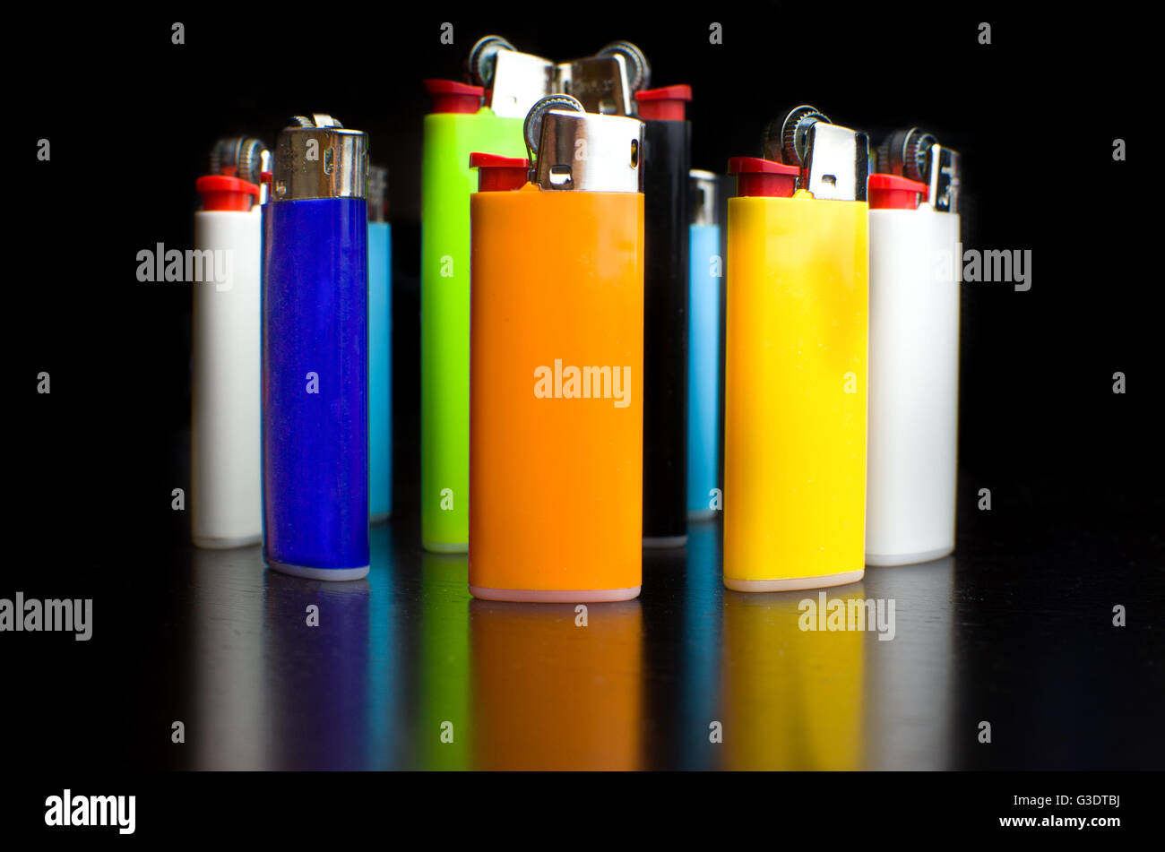 colorful lighters black background Stock Photo - Alamy