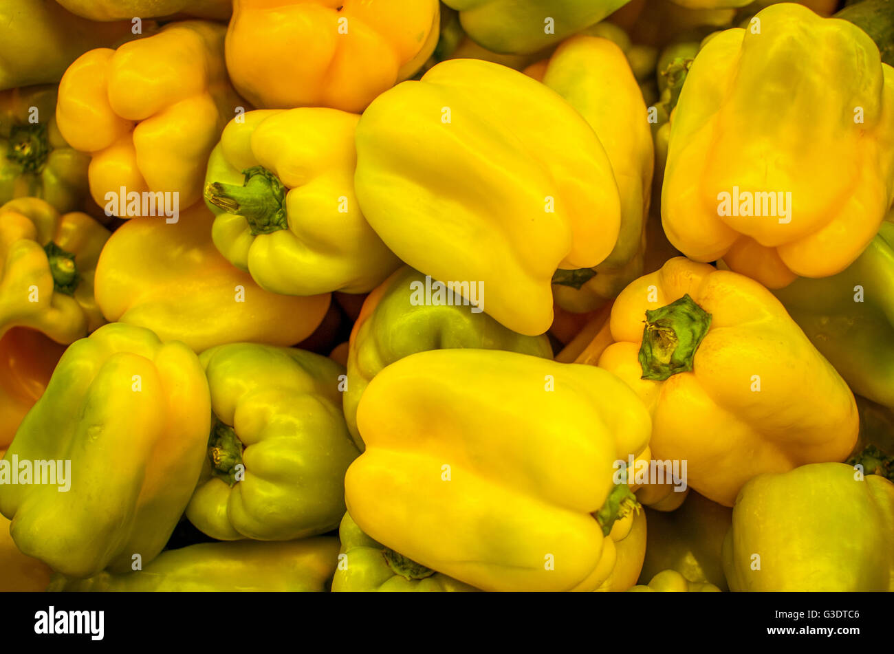 yellow bell peppers background textured Stock Photo - Alamy