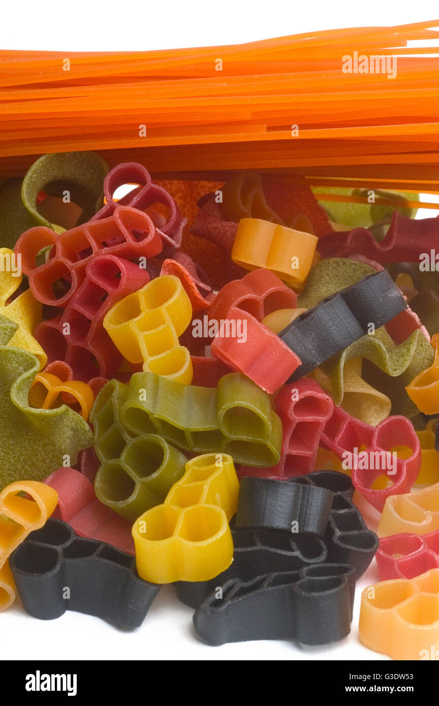 Italian colorful pasta in a funny shape photographed in studio on white ...